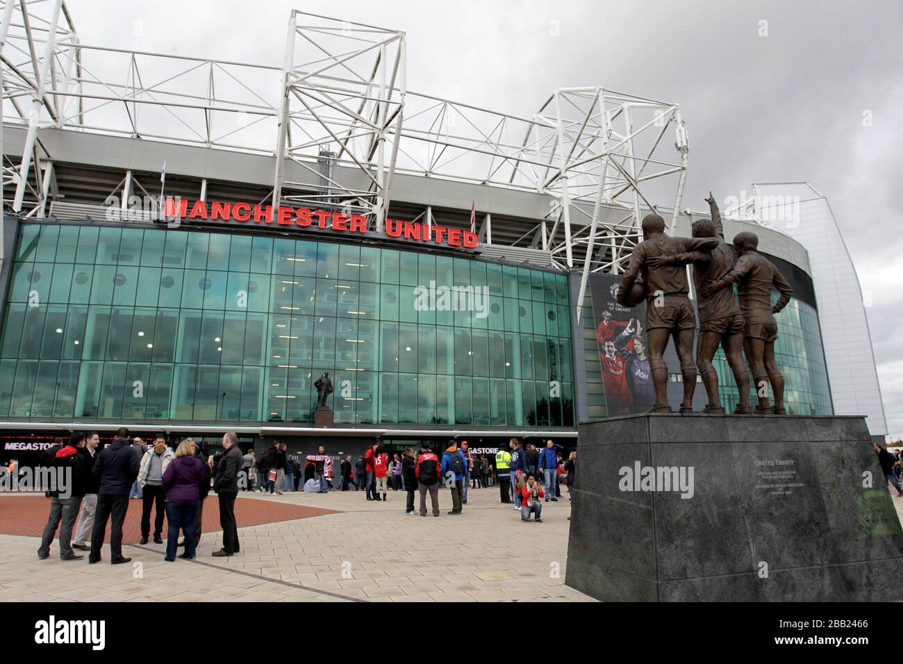 George best denis law bobby charlton statue old trafford hi-res stock ...