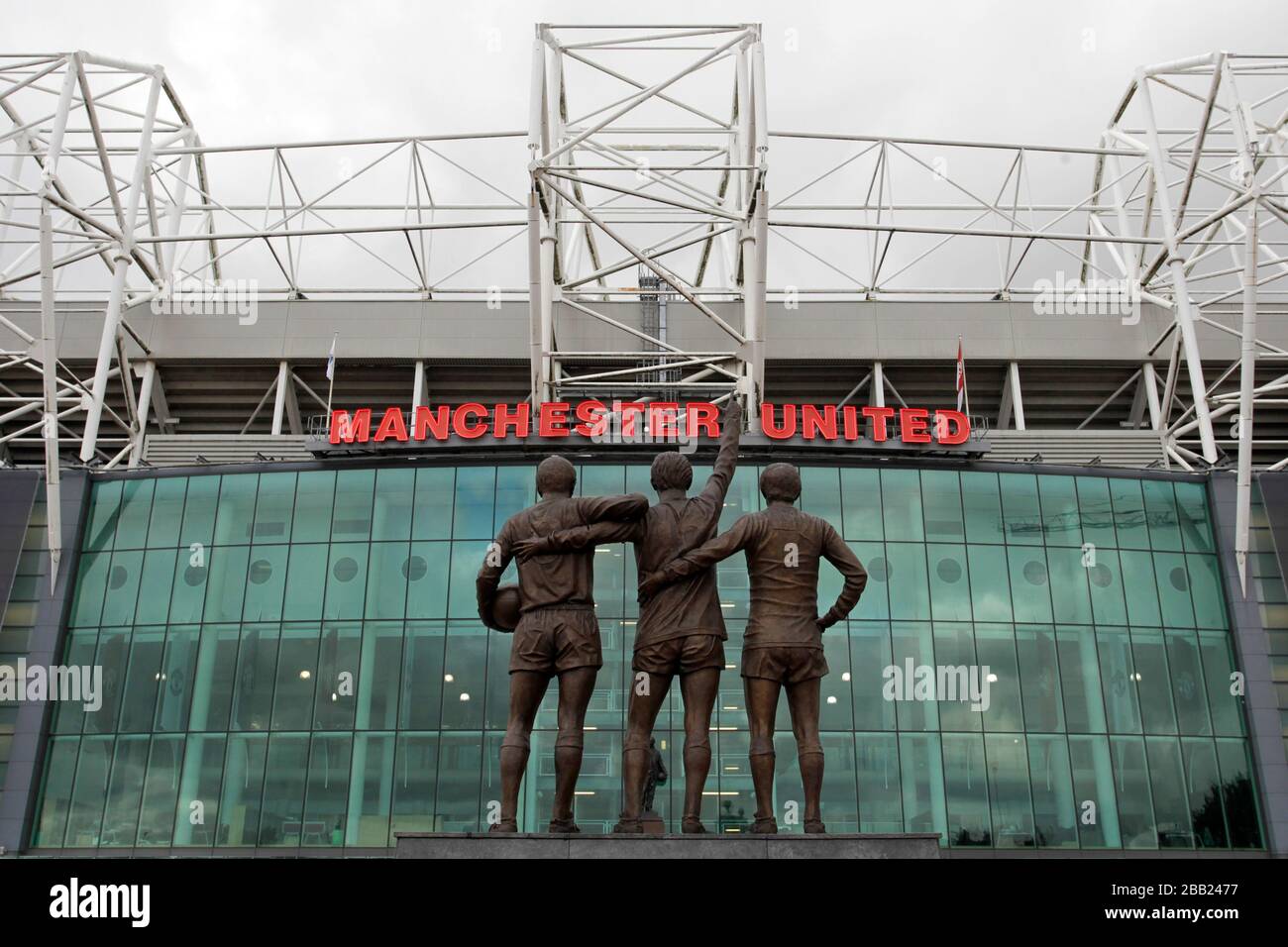 George best denis law bobby charlton statue old trafford hi-res stock ...