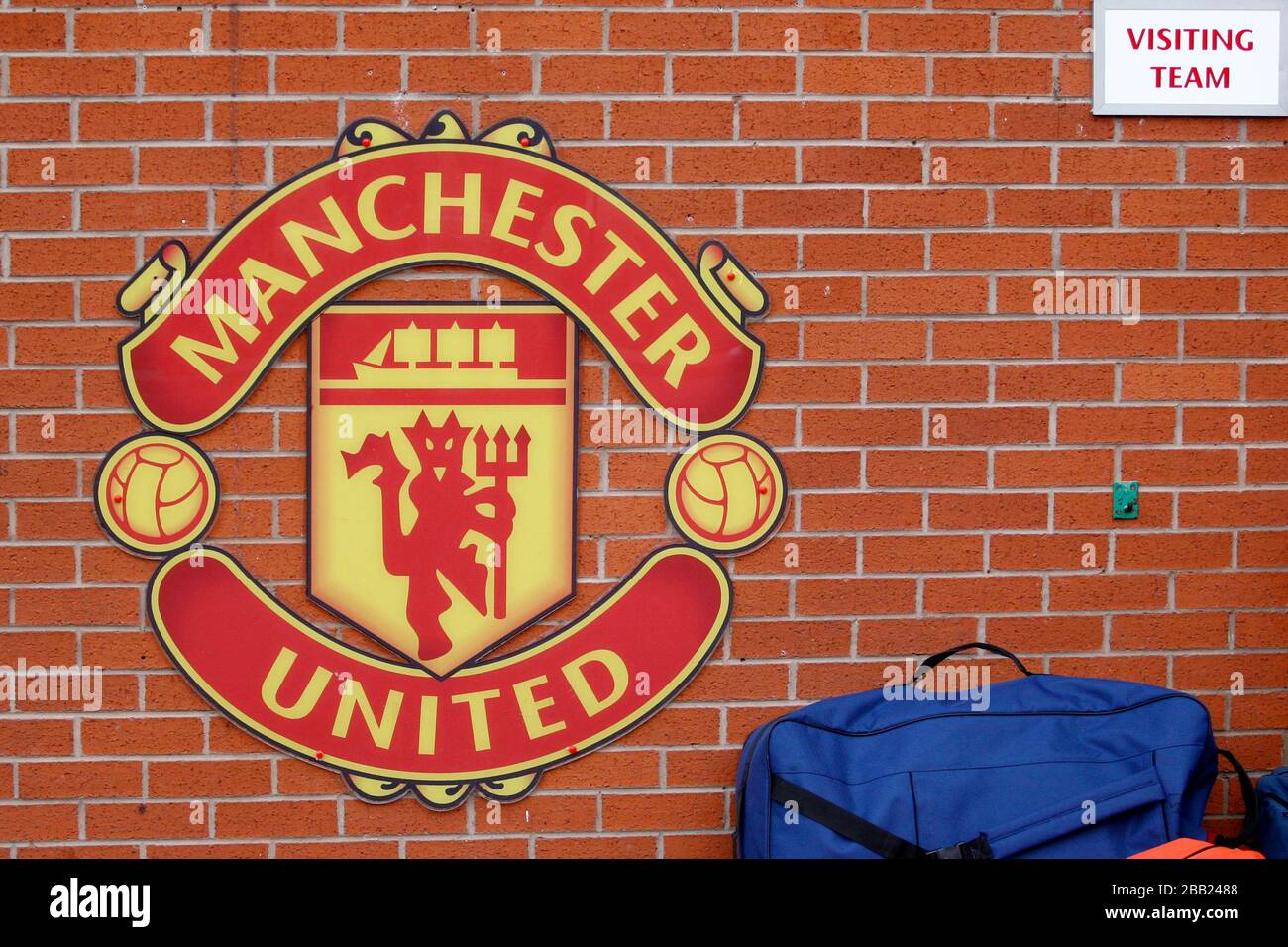 Manchester United badge on the wall at Old Trafford Stock Photo - Alamy