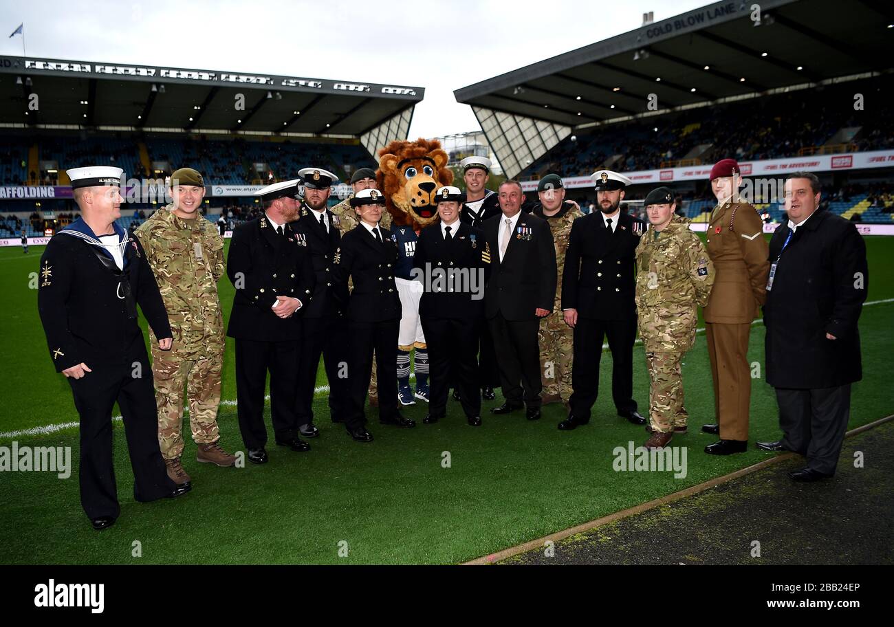 Members of the armed forces pose for a picture on the pitch prior to ...