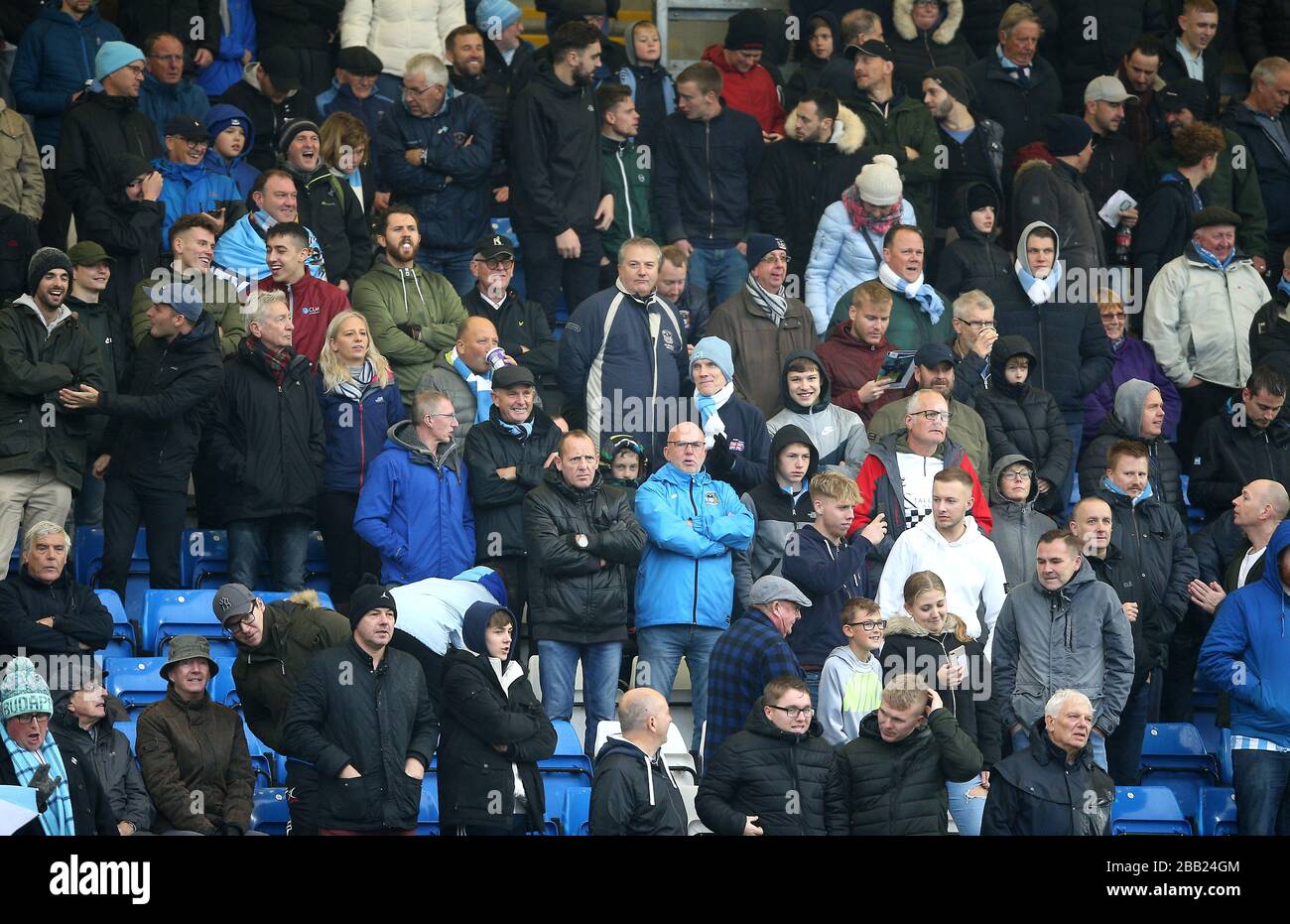 Coventry City fans in the stands show their support Stock Photo - Alamy