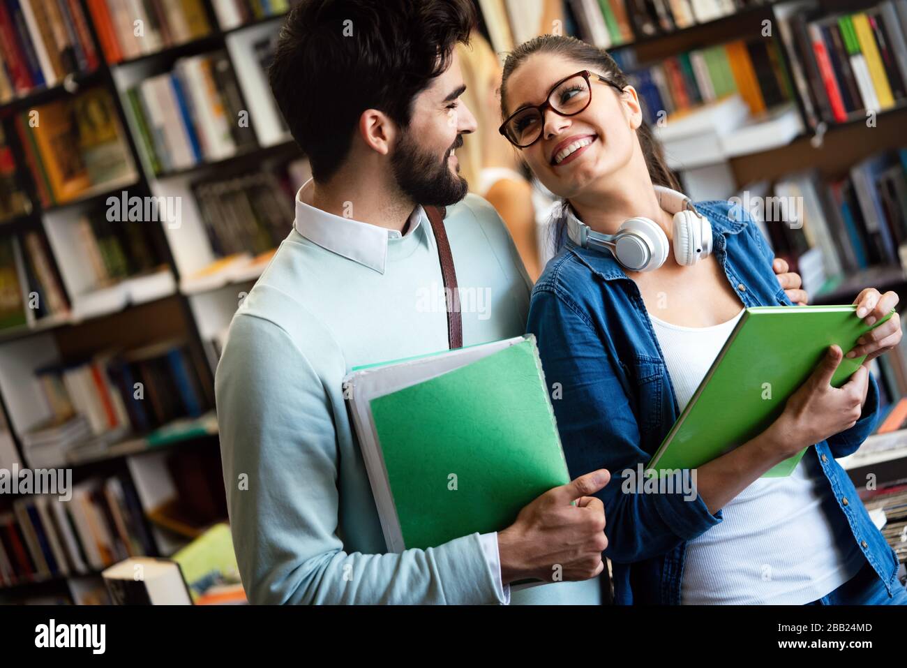 Group of college students studying in the school library Stock Photo ...