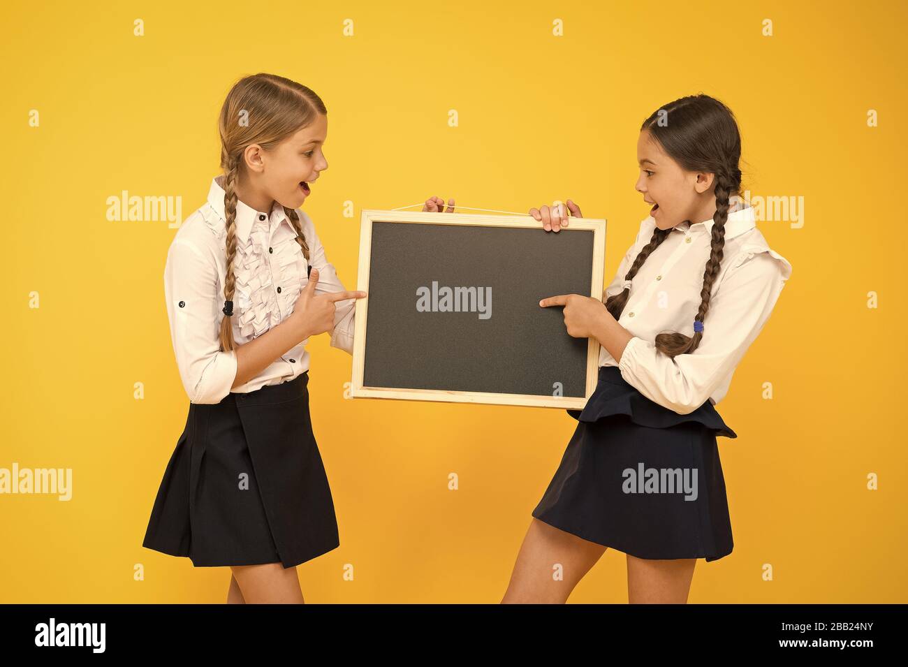 Learning fun at lesson. Cute small schoolchildren reciting lesson at ...