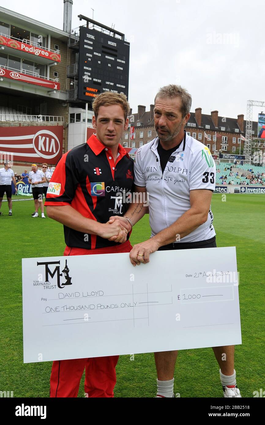 Matthew Maynard presents a cheque to Glamorgan's David Lloyd (left ...