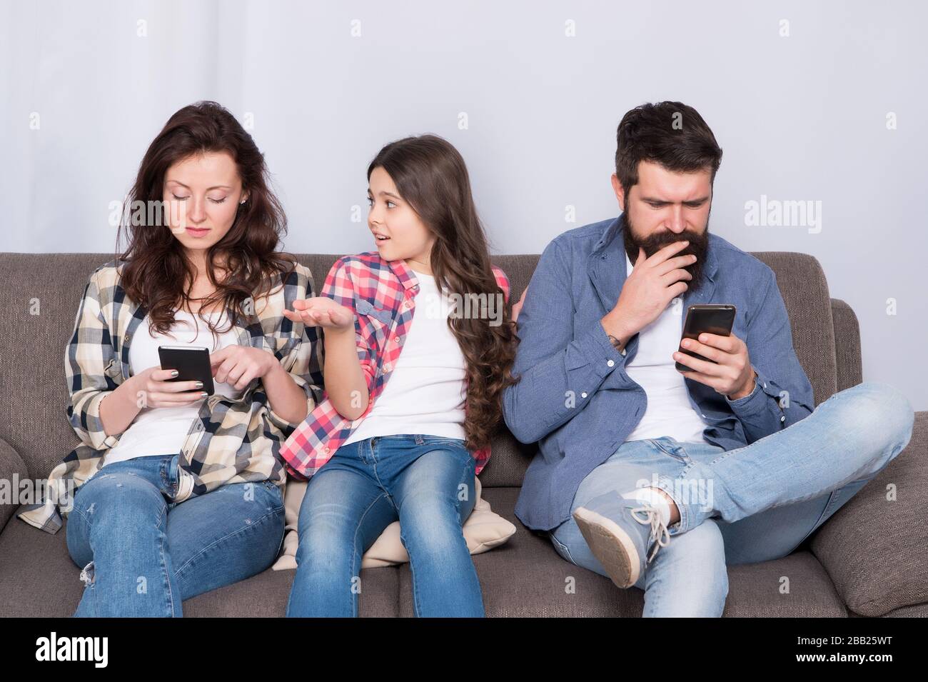 Mobile device affecting relationship. Unhappy kid complain at parents ...