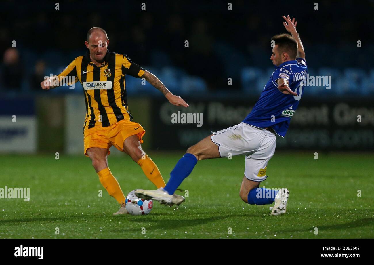 Southport's Jamie Milligan and Macclesfield Town's Chris Holroyd (right ...