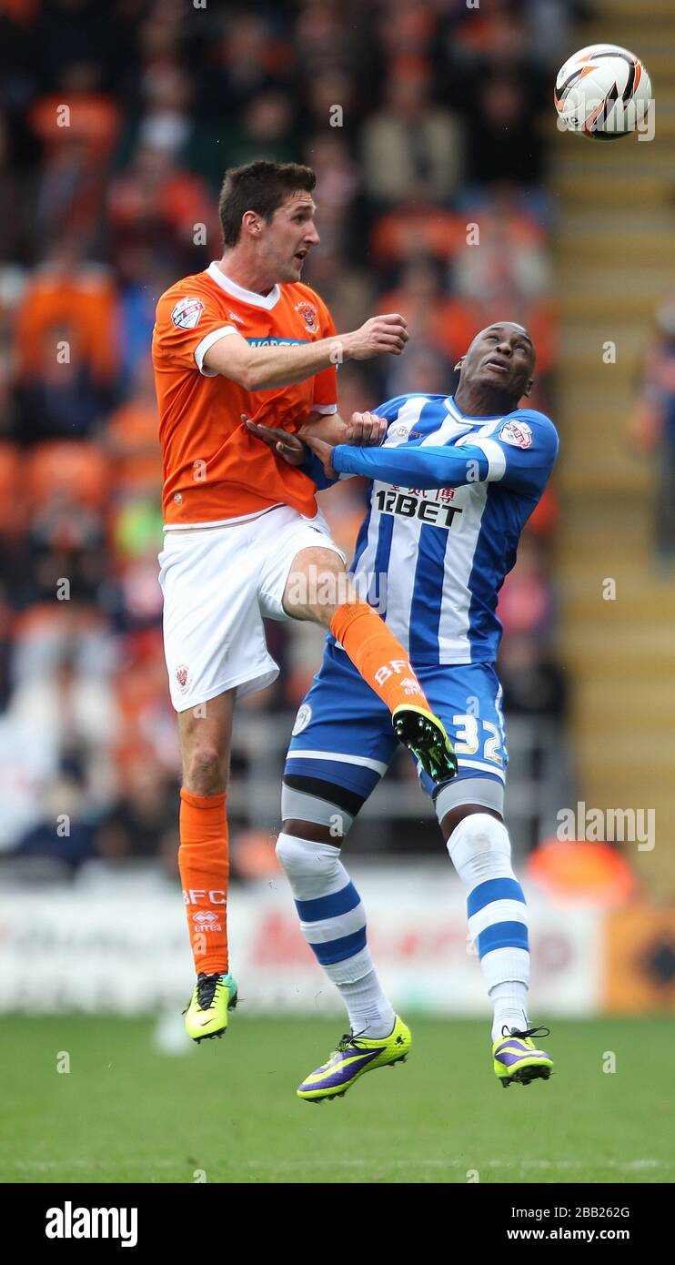Blackpool's Chris Basham and Wigan Athletic's Emmerson Boyce (right ...