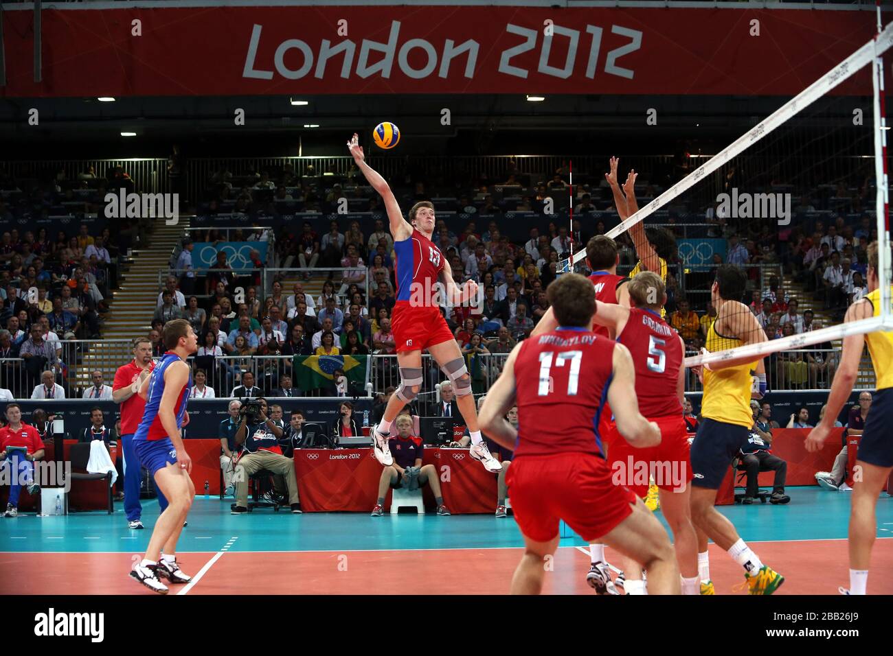 Russia's Dmitriy Muserskiy plays a shot against Brazil in the Men's ...