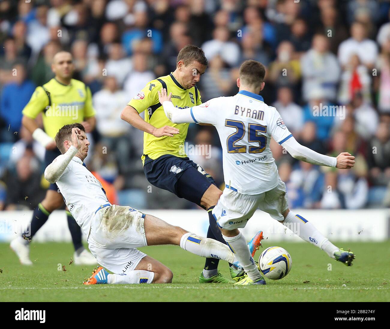 Leeds United's Luke Murphy (left) and Sam Bryan battle for the ball ...