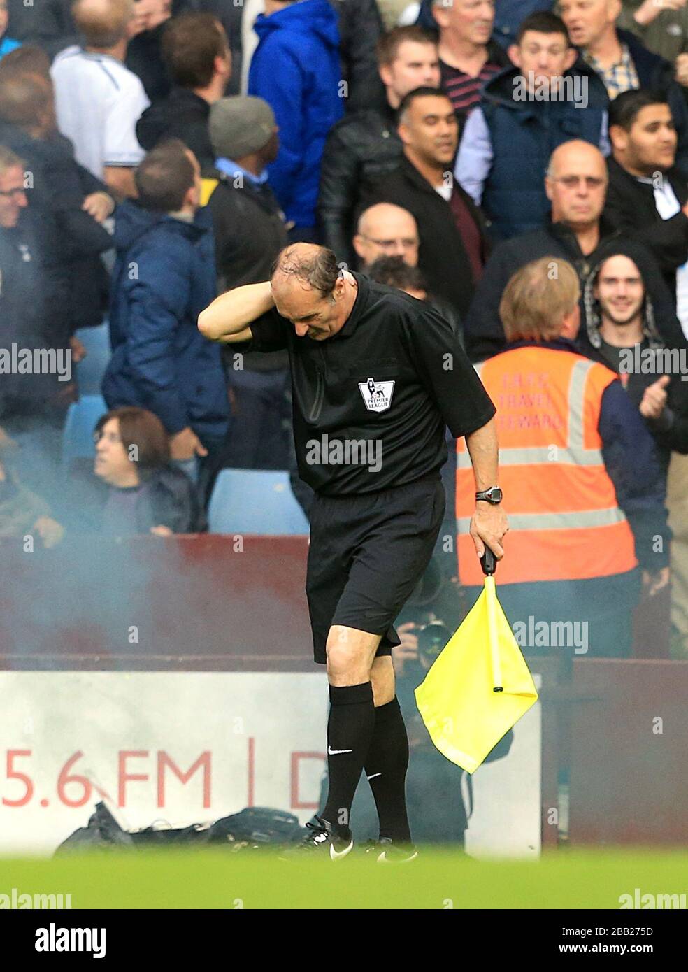 Assistant referee David Bryan is struck by a flare Stock Photo - Alamy