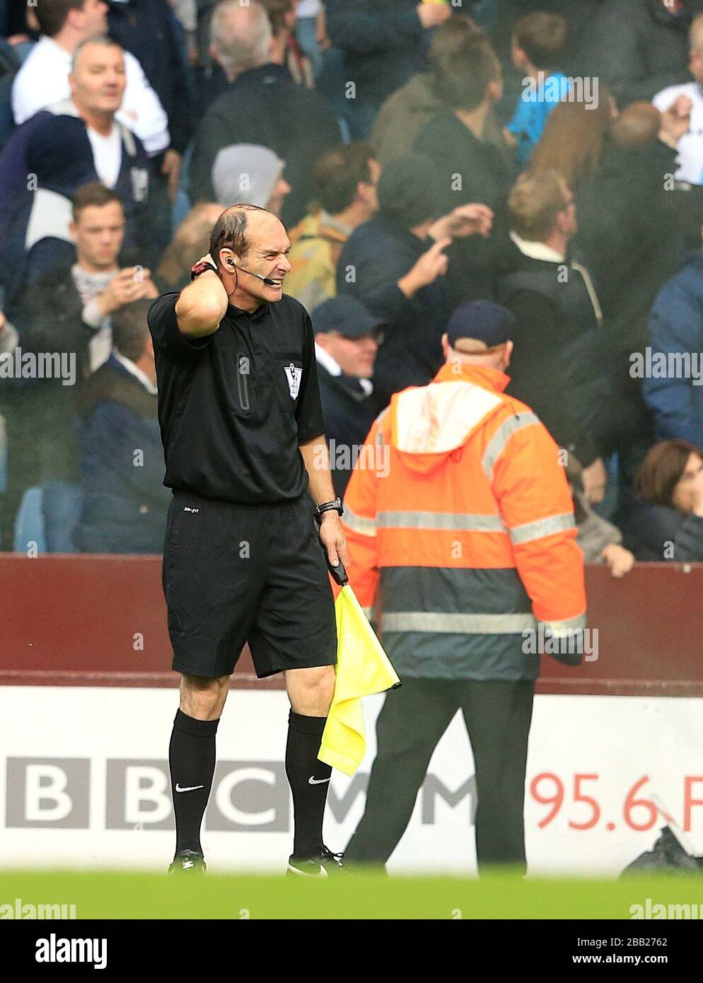 Assistant referee david bryan is struck by a flare hi-res stock ...