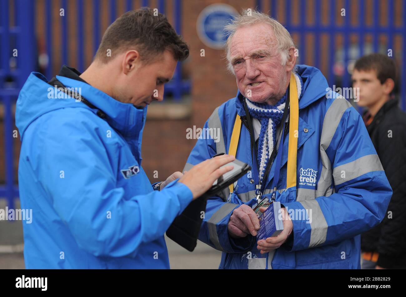 Everton staff in the fan zone Stock Photo - Alamy