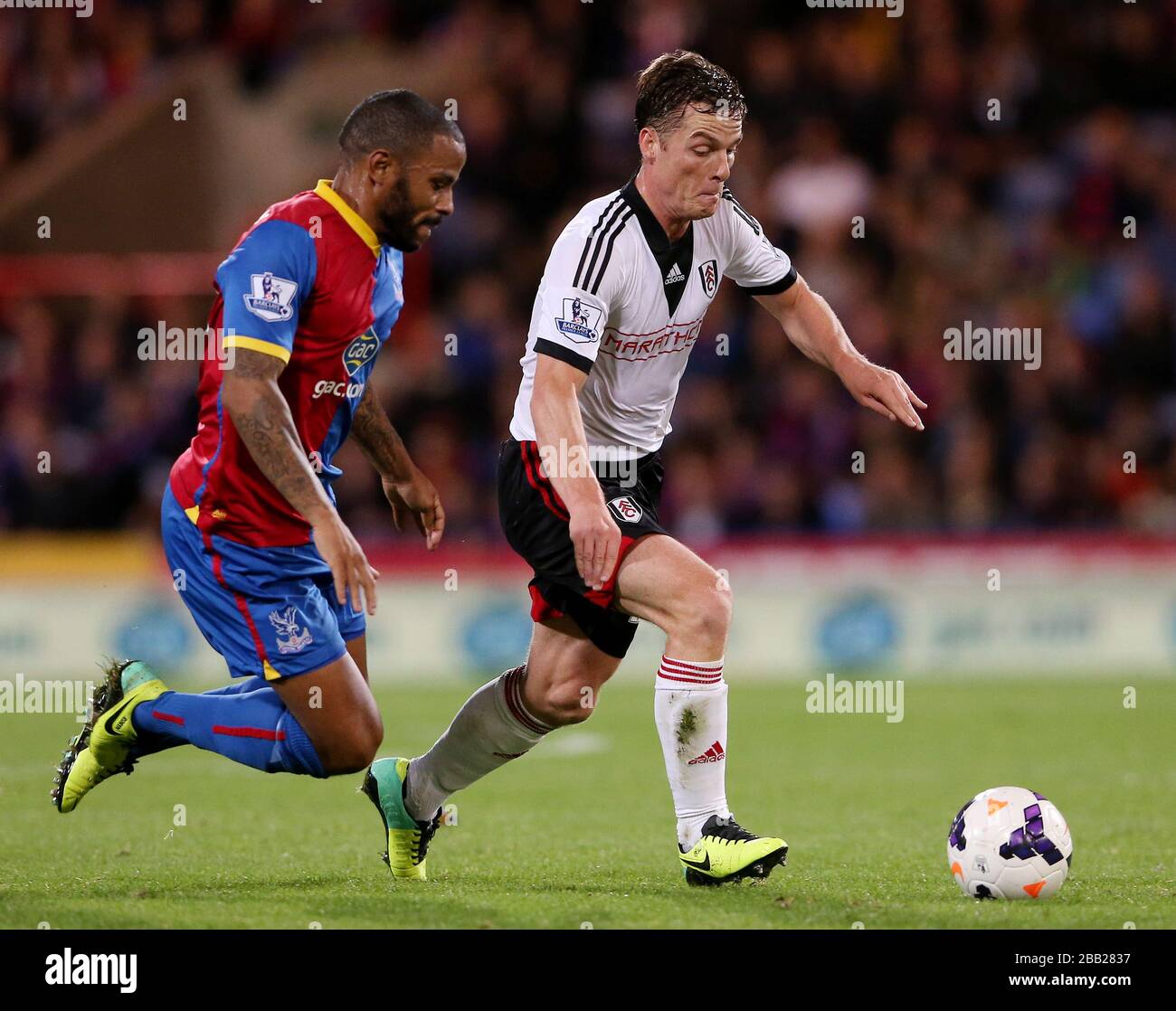 Fulham's Scott Parker (right) battles for the ball with Crystal Palace ...
