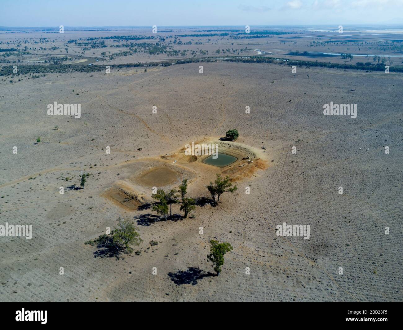 Aerial of near empty farm dam during an extended drought in Queensland ...