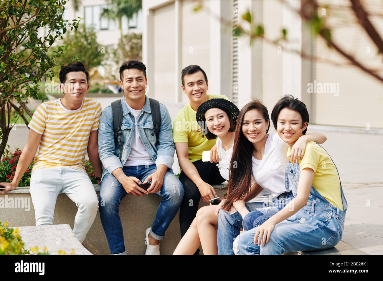 Happy Vietnamese young people spending time together outdoors Stock ...