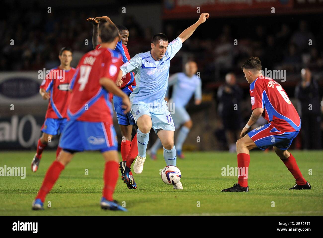 Coventry City's Callum Ball (centre) dances through the Dagenham ...