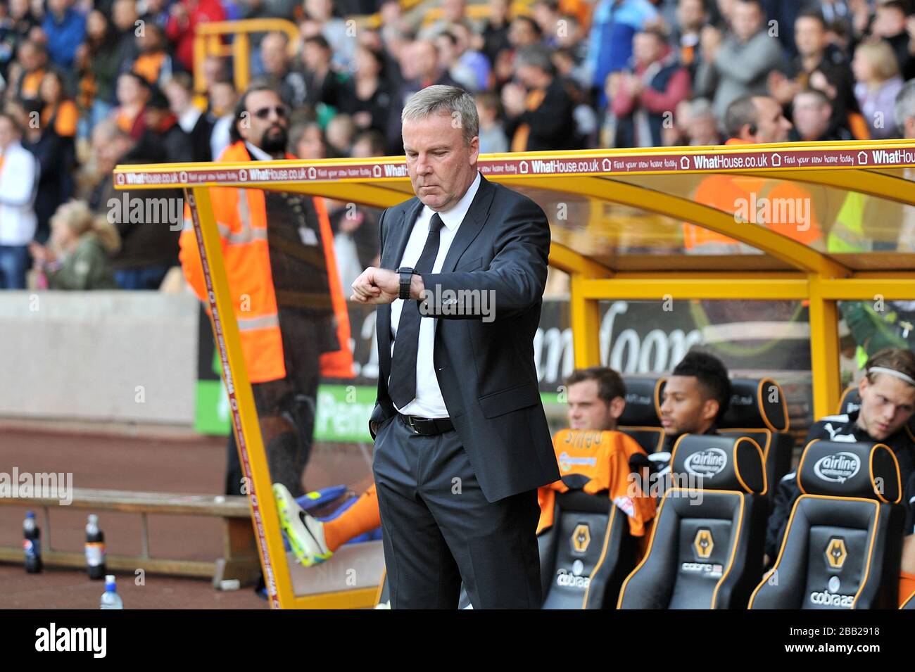 Wolverhampton Wanderers manager Kenny Jackett checks his watch on the ...