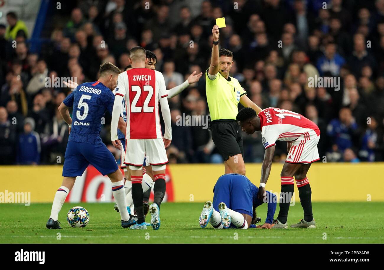 Ajax's Quincy Promes (right) is shown the yellow card by referee ...