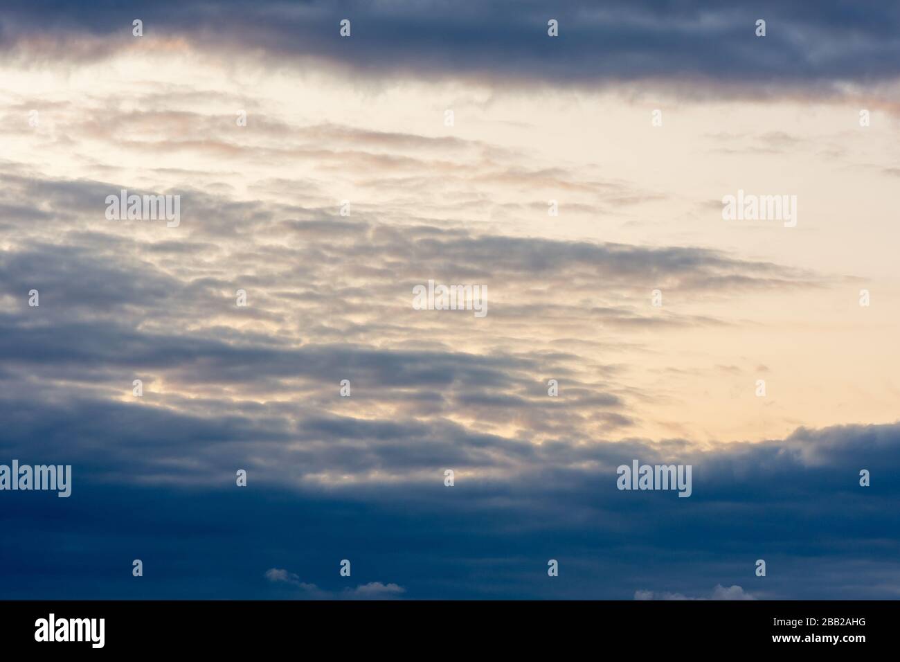 texture of a colorful sky with clouds and sun Stock Photo - Alamy