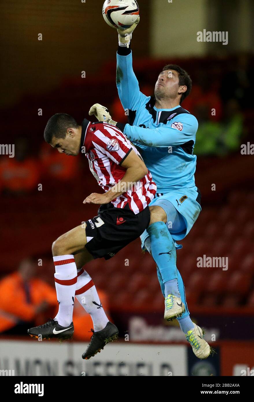 Sheffield United's Conor Coady (left) and Crawley Town goalkeeper Paul ...