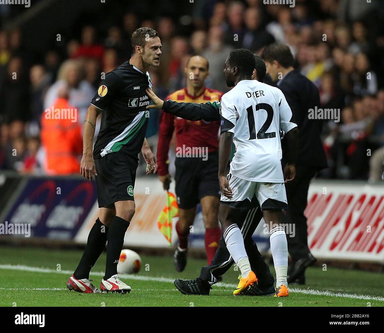 St Gallen's Ivan Martic (left) and Swansea City's Nathan Dyer exchange ...