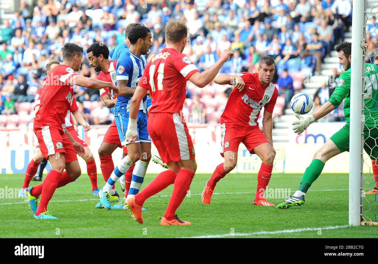 Wigan Athletic striker Grant Holt's header goes past the hand of ...