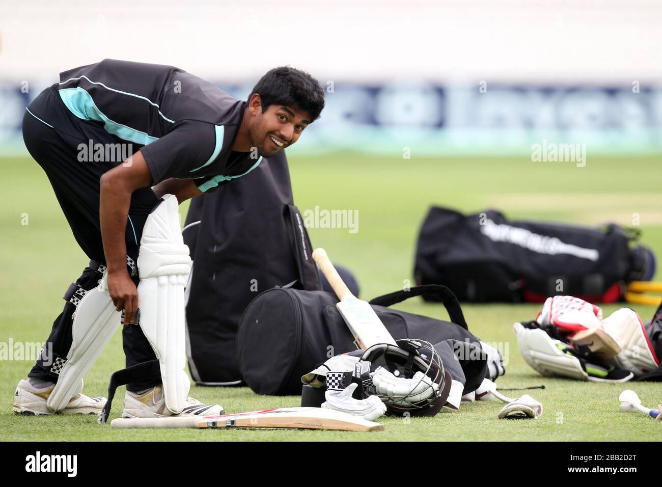 Surrey's Arun Harinath gets padded up before the match Stock Photo - Alamy