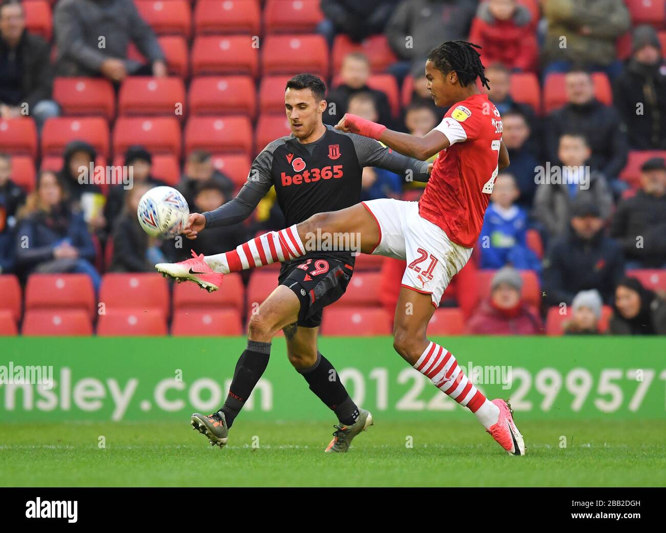 Stoke City's Lee Gregory battles with Barnsley's Toby Sibbick Stock ...