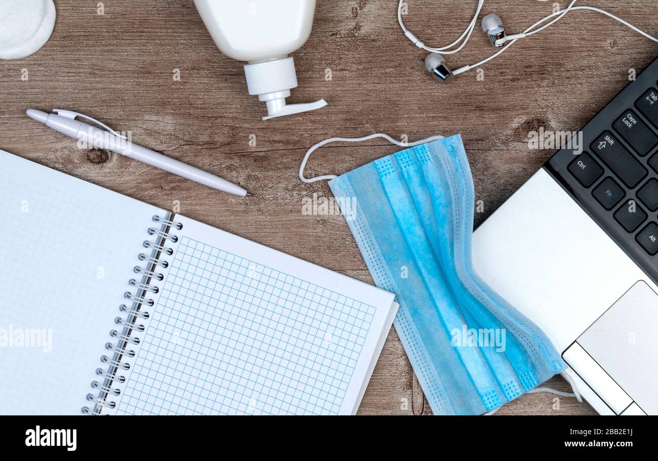 hygiene in the office. remote work kit on wooden desk. sanitizer gel ...