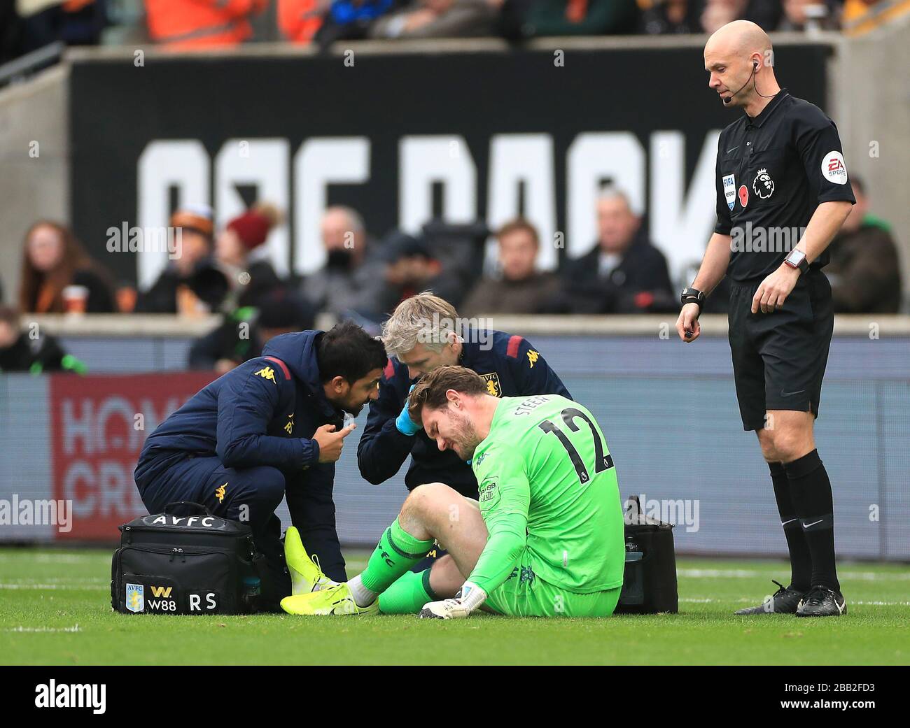 Aston Villa goalkeeper Jed Steer receives treatment for an injury as ...