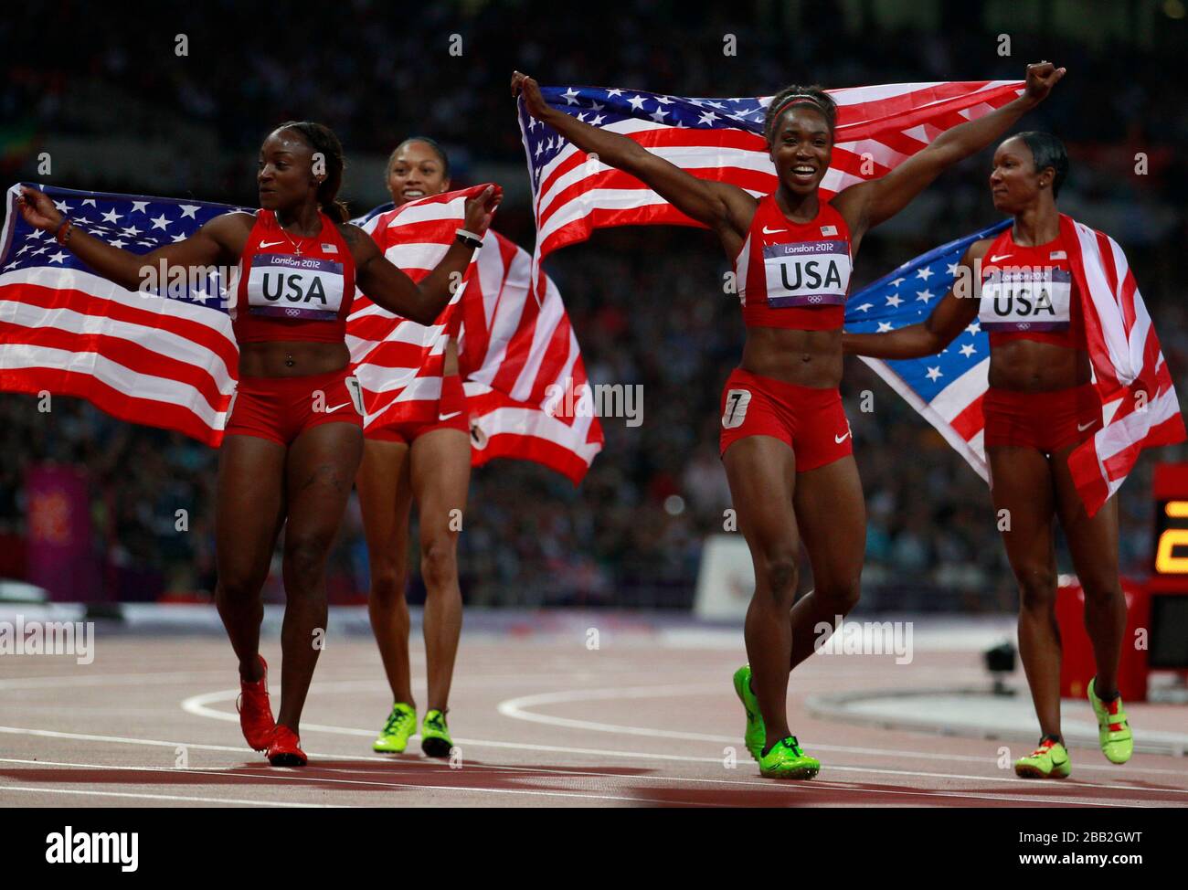 Members of the USA's 4x100metre womens relay team celebrate breaking ...