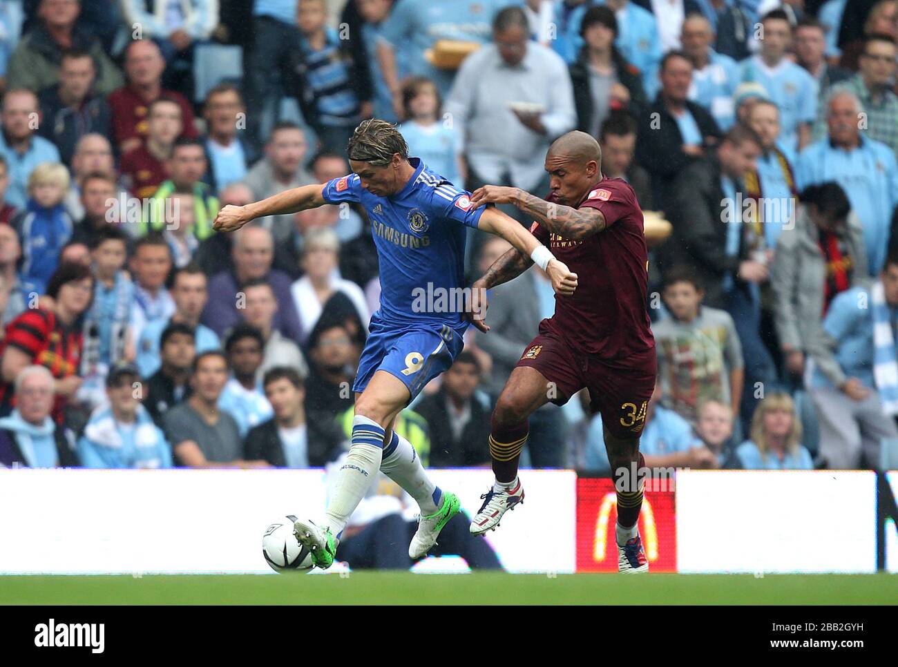 Chelsea's Fernando Torres (left) and Manchester City's Nigel De Jong ...