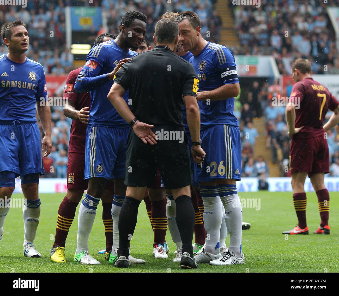 Chelsea's John Terry (right) and Jon Obi Mikel have a word with referee ...