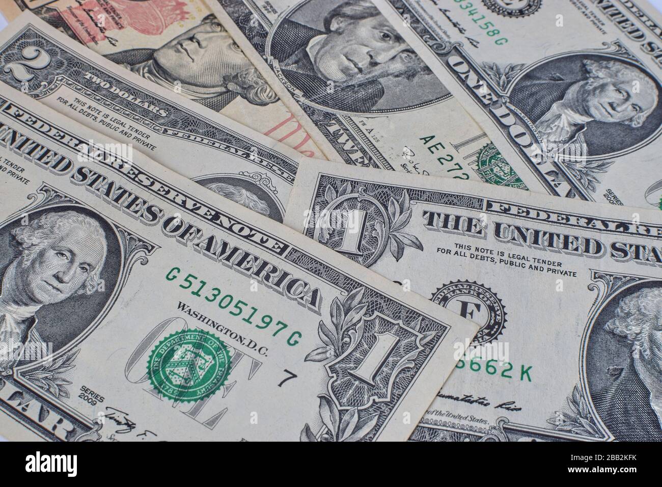the background of us dollar bills is scattered on the table Stock Photo ...