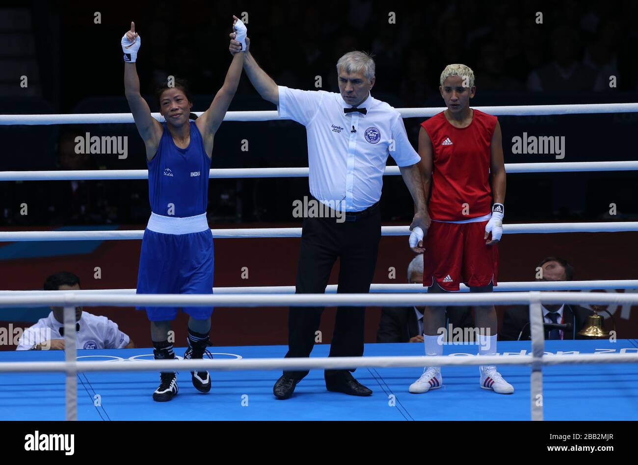 India's Women boxer Chungneijang Mery Kom Hmangte (blue) celebrates her ...