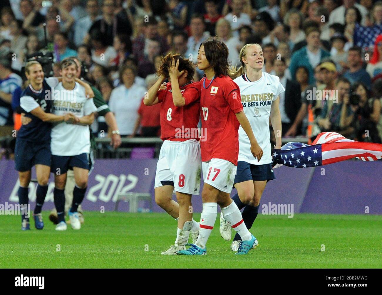 Japan's Aya Miyama is consoled by Yuki Ogimi during the women's ...