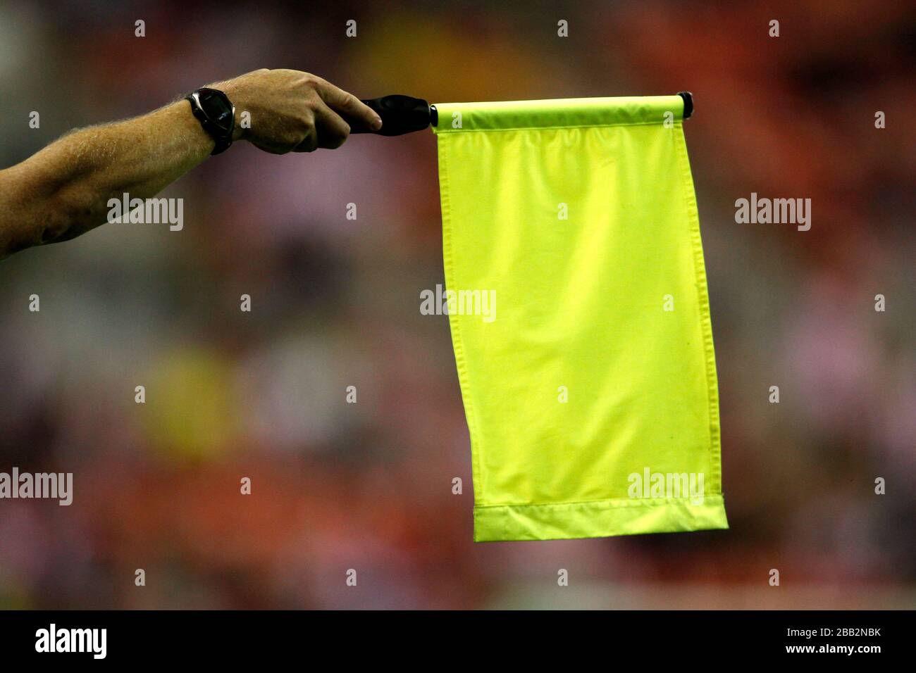 The assistant referee waves his flag hi-res stock photography and ...
