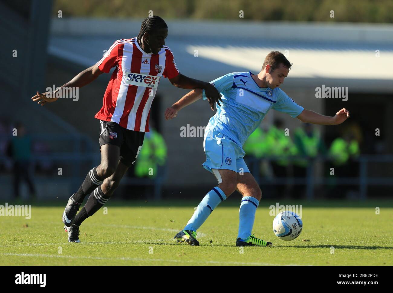 Brentford's Clayton Donaldson (left) and Coventry City's Blair Adams ...