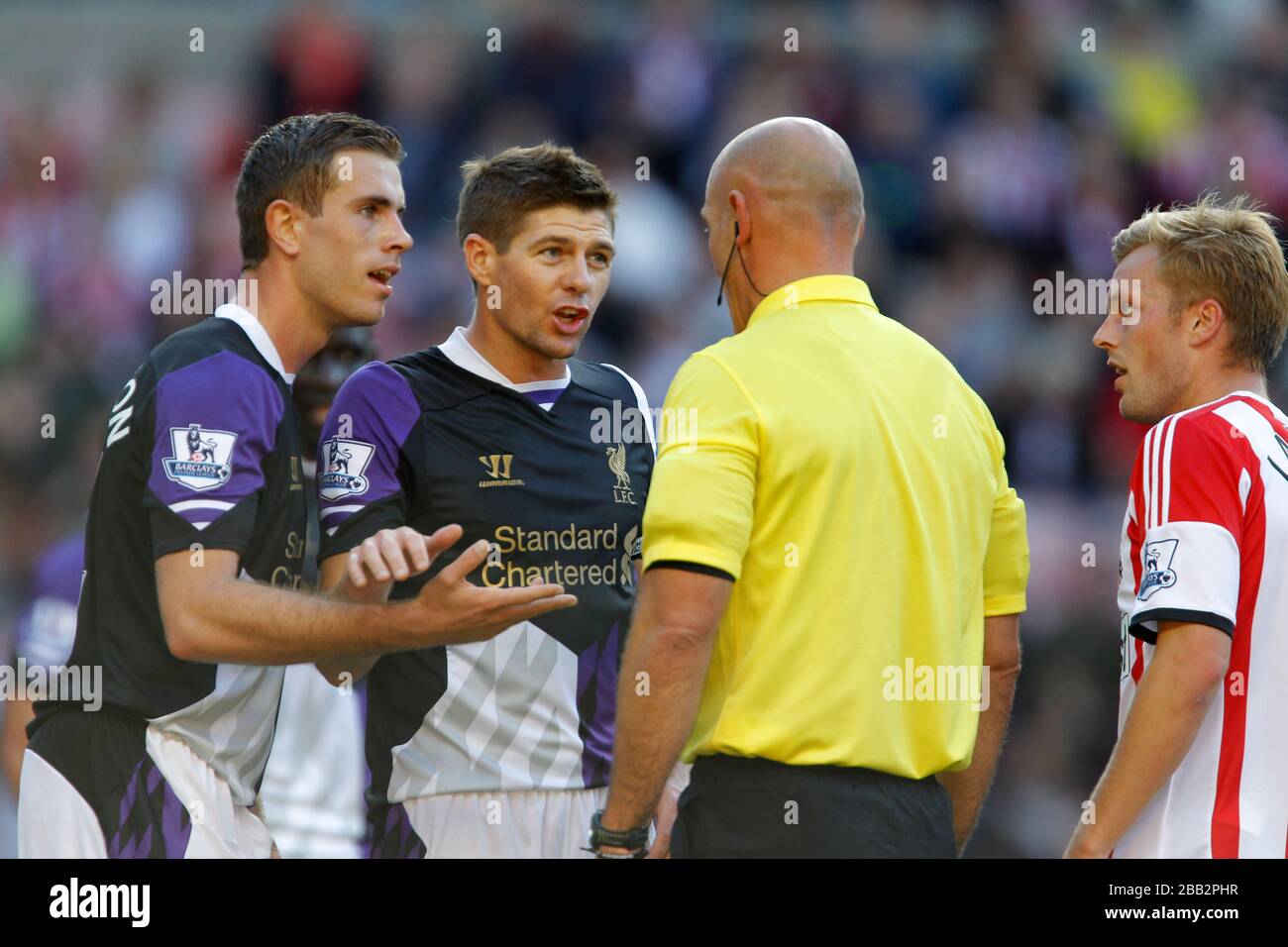 Liverpool's Jordan Henderson (left) and Steven Gerrard speak with ...