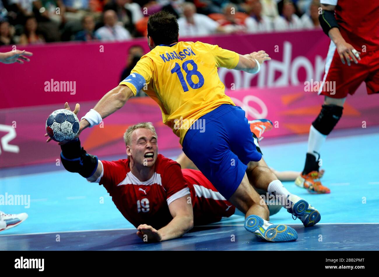 Denmark's Rene Hansen Toft tries to get his shot away as he is grounded ...