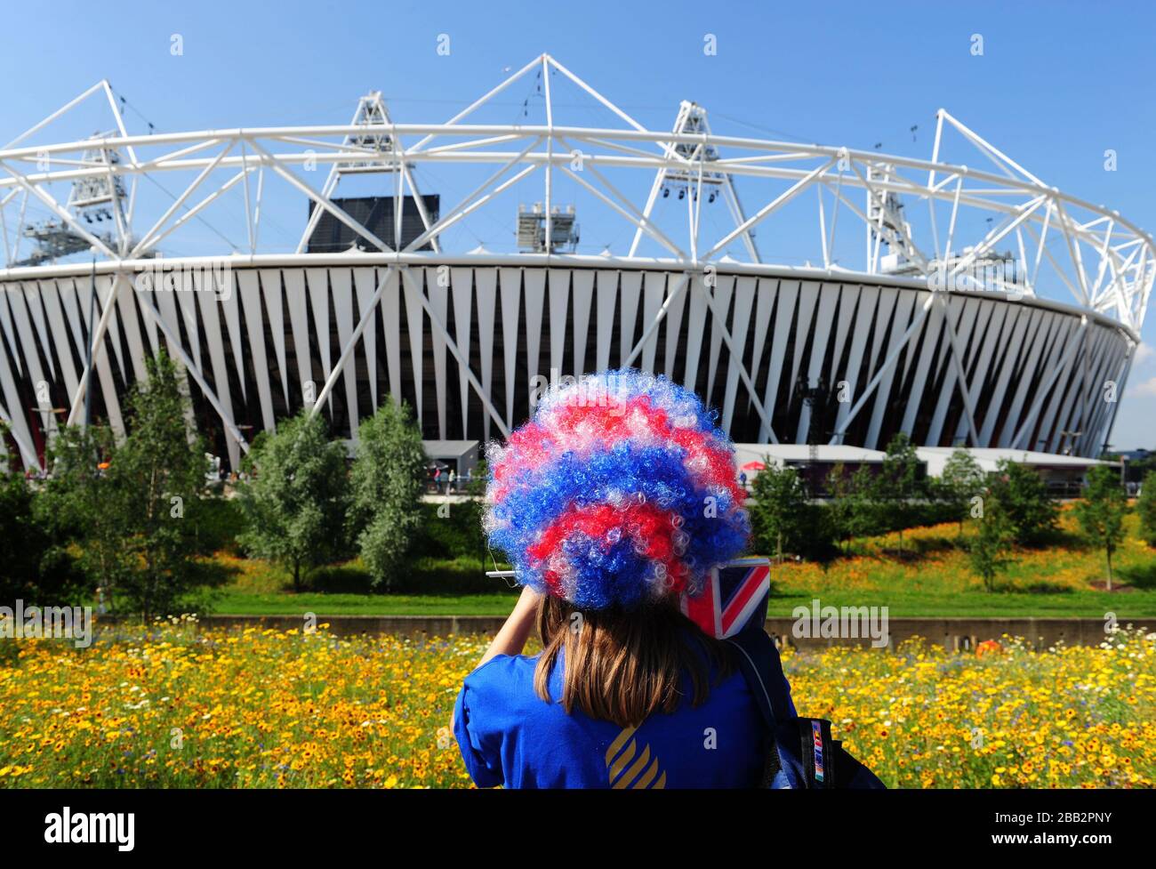 Spectators take pictures of the Olympic Stadium in London Stock Photo ...