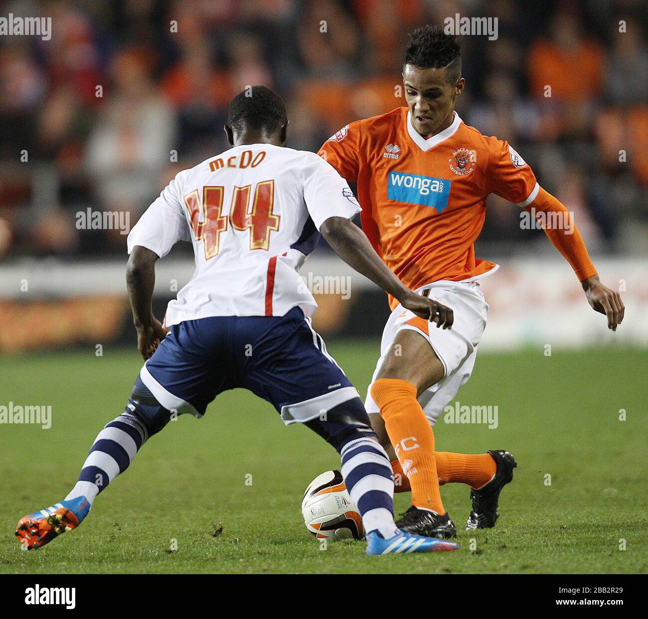 Blackpool's Tom Ince and Bolton Wanderers' Mohamed Medo in action Stock ...