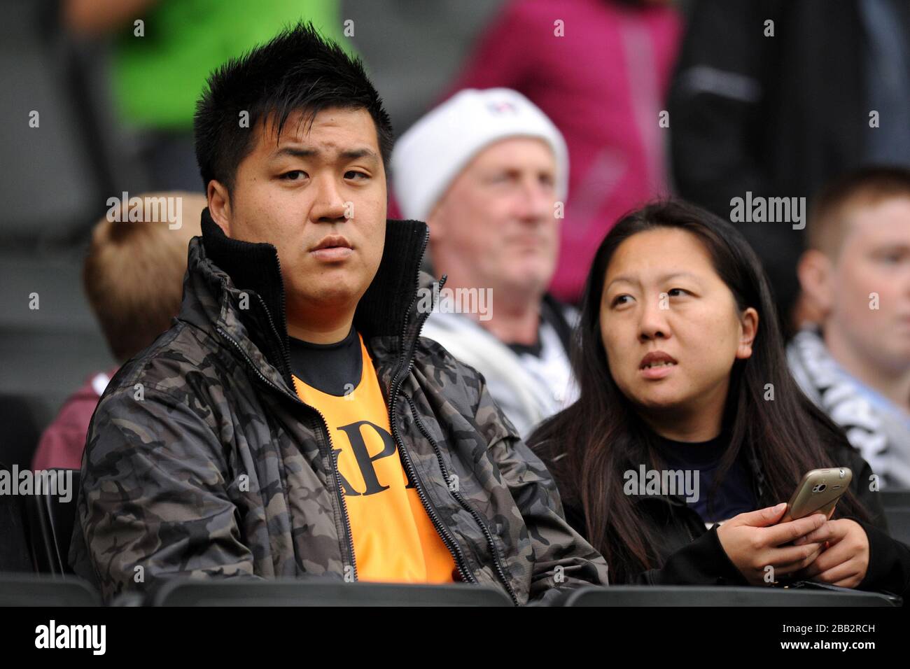 Fulham fans in the stands Stock Photo - Alamy