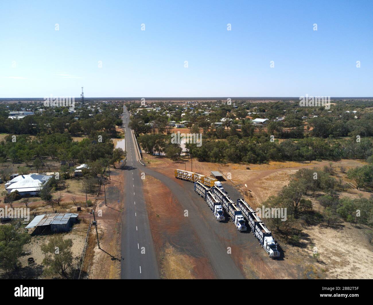 Aerial of cattle livestock road trains at Cunnamulla Western Queensland ...