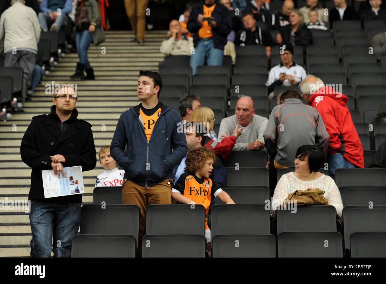 Fulham fans in the stands Stock Photo - Alamy