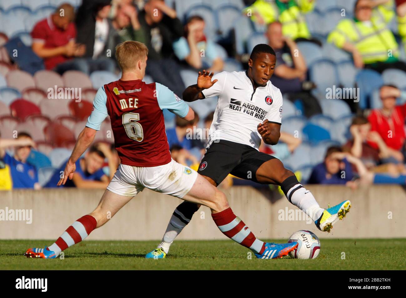 Burnley's Ben Mee (left) and Charlton Athletic's Callum Harriotts ...
