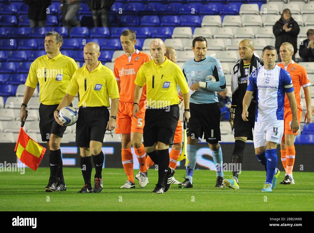 Andy Woolmer(2nd Left) and Match officials enter the pitch Stock Photo ...