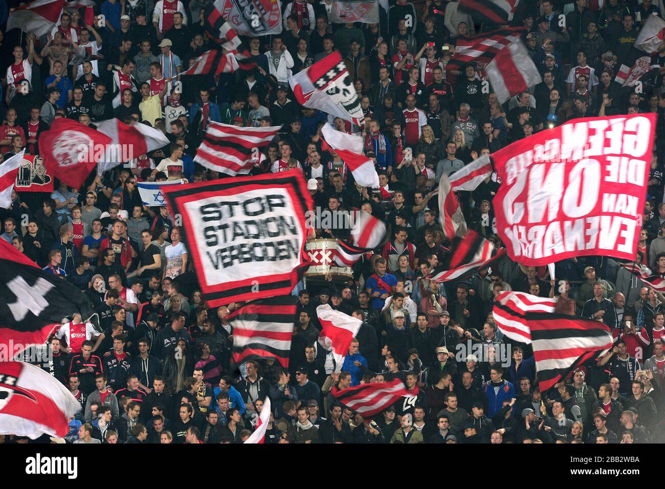 Ajax fans cheer on their side in the stands Stock Photo - Alamy