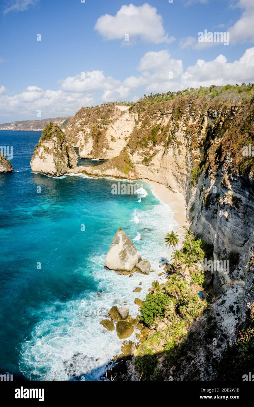 Popular photo spot and tourist destination Atuh Beach and cliff, in ...