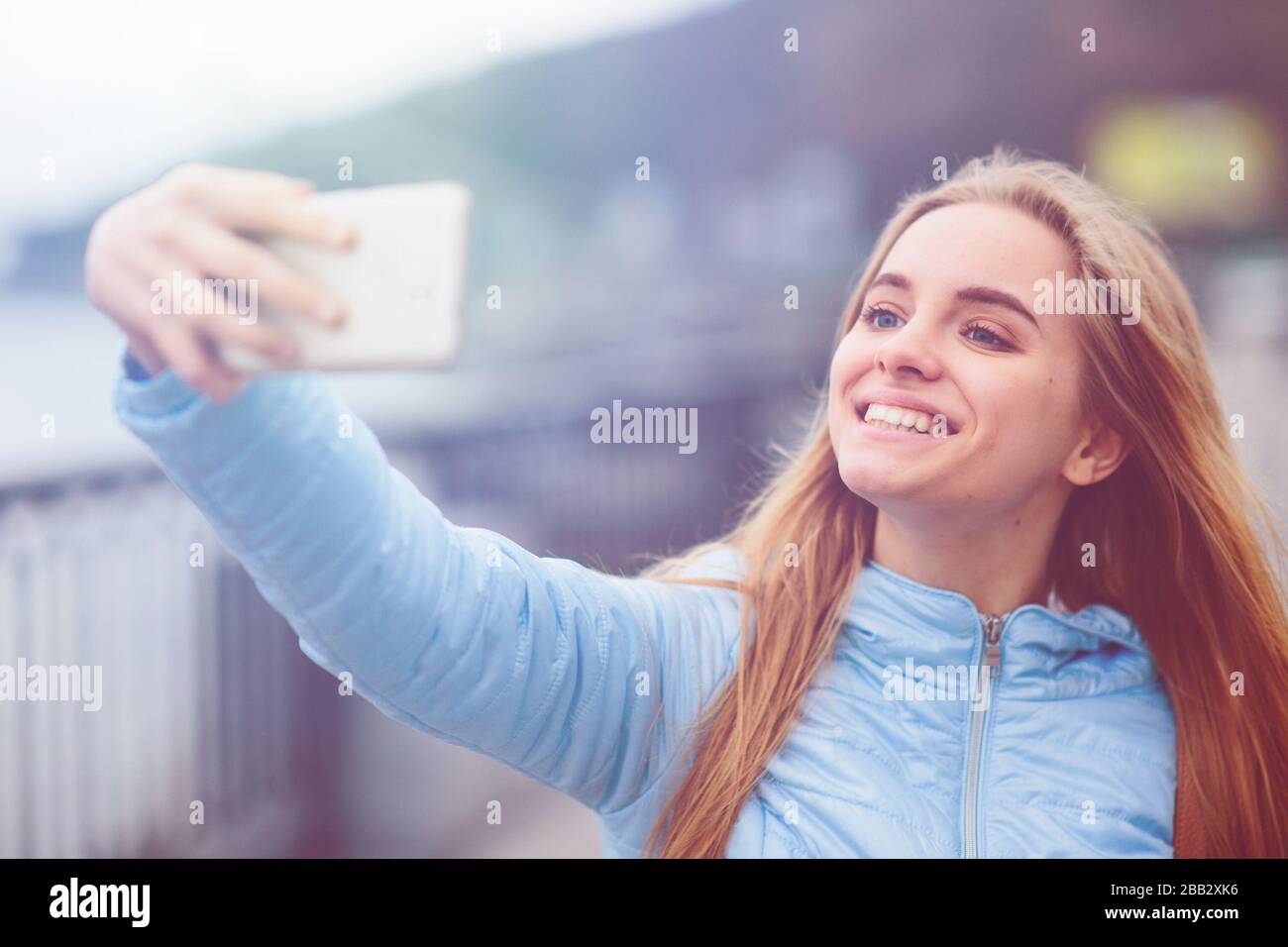 Pretty Woman Taking A Selfie Beautiful Girl Walking On The Streets And
